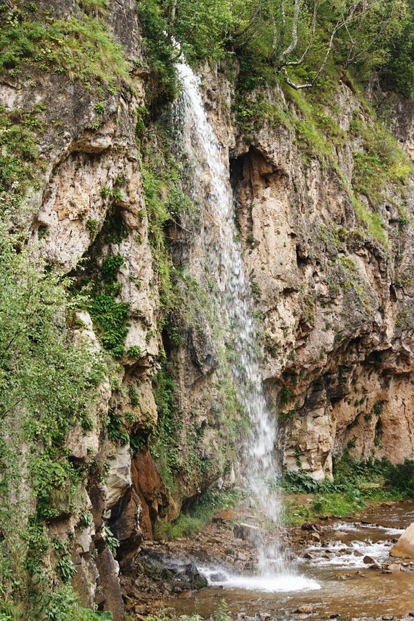 Landscape with High Waterfall Falling Off Cliff in North Caucasus Stock ...