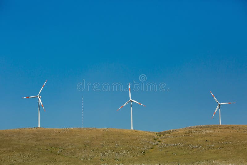 Landscape with Hills and Wind Tree Turbines Stock Photo - Image of ...