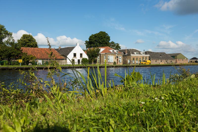 Dutch Typical Houses by the River Bank Stock Photo - Image of river ...