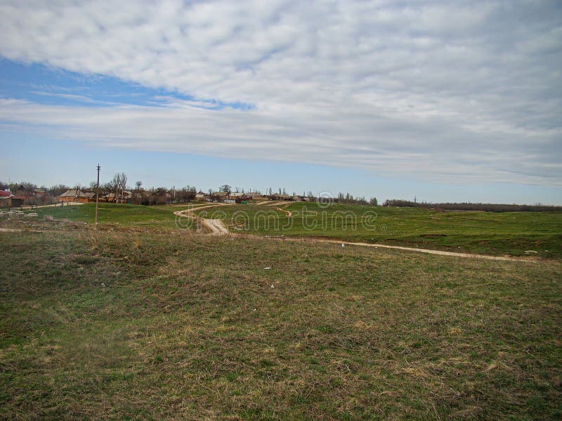 Landscape Image of an Open Field with a Curving Dirt Path Leading To ...