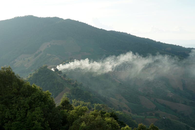 The Landscape of the Mountain Range with the Smoke Stock Photo - Image ...