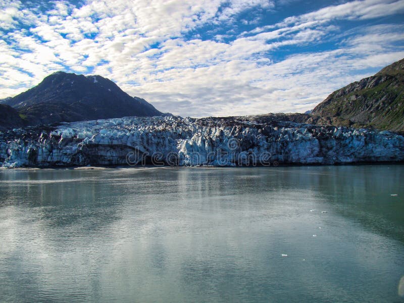 Landscape of Mountains and Cliffs Surrounded by Water Under a Blue ...