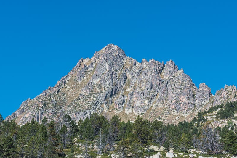Landscape of Pyrenees Mountains with Trees and a Very Large Rock in the ...