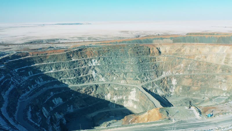 Open-cast Mine with Two Trucks Riding Along Its Road. Quarry, Opencast ...