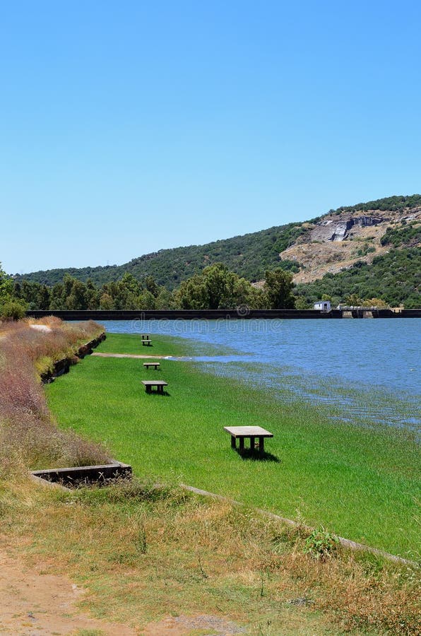 Landscape with Picnic Tables-vertical Stock Photo - Image of water ...