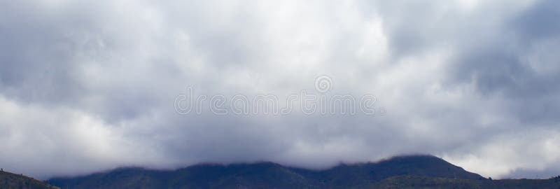 Landscape of Rain Clouds Over Mountains. View of the Clouds Over the ...