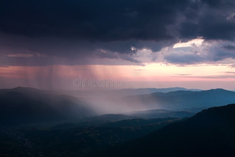 Landscape of Rain Clouds Over the Valley between Mountains Stock Image ...