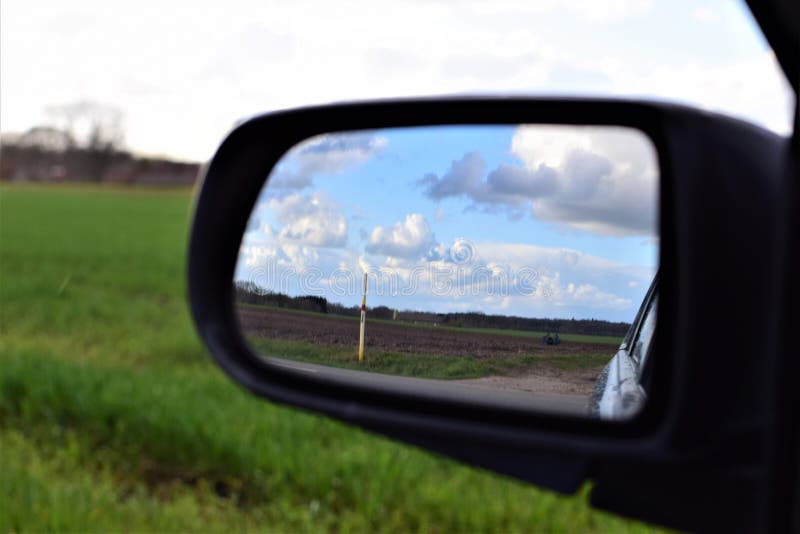 The Landscape is Reflected in the Exterior Mirror of a Car Stock Photo ...