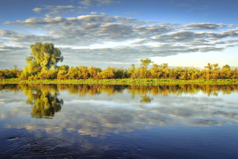 Landscape of River with Reflections of Shore and Sky in Water. Spring ...