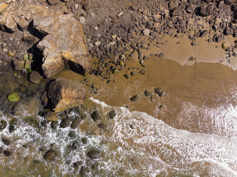 Landscape with Rocks, the Ocean and Many Stones. Top View, Texture ...