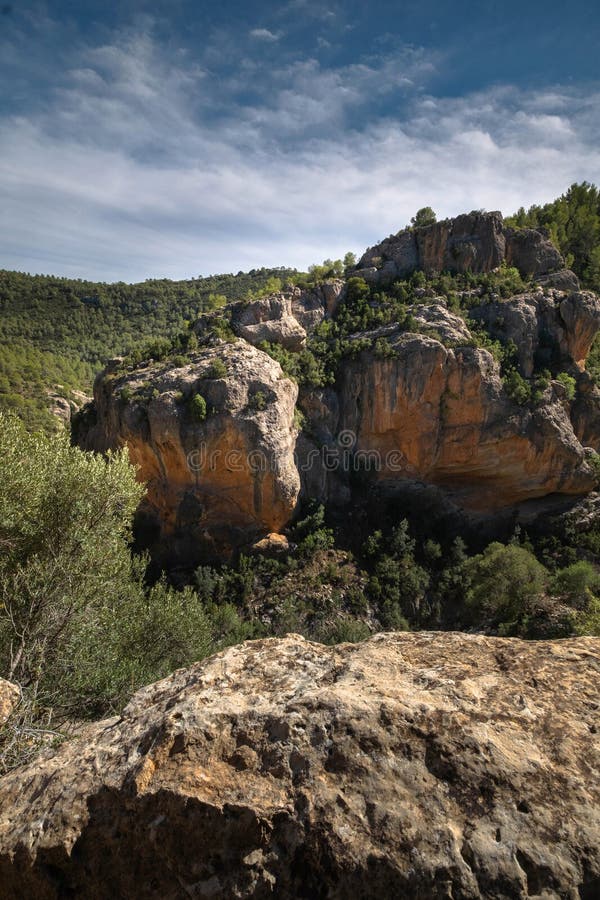 Landscape of Rocky Cliffside Path Overlooking Lush Green Valley with ...