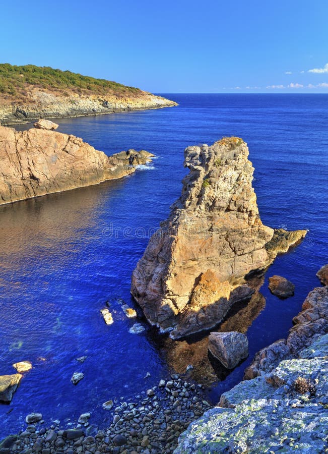 Landscape on rocky shore stock photo. Image of light - 122997944