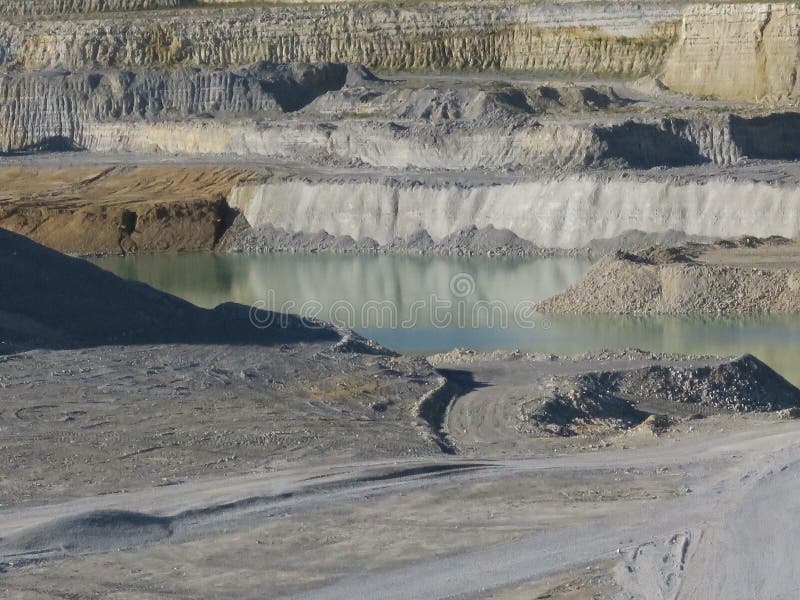 Landscape in a Sand Pit with Gray Gravel an a Pool of Water Stock Photo ...