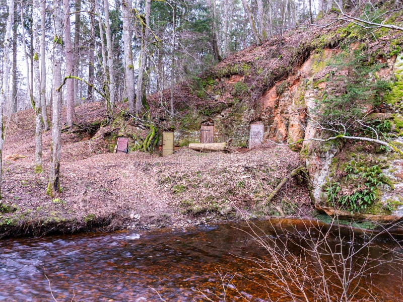 Sandstone Rock Wall by the River with Forest, Rock Reflection in the ...