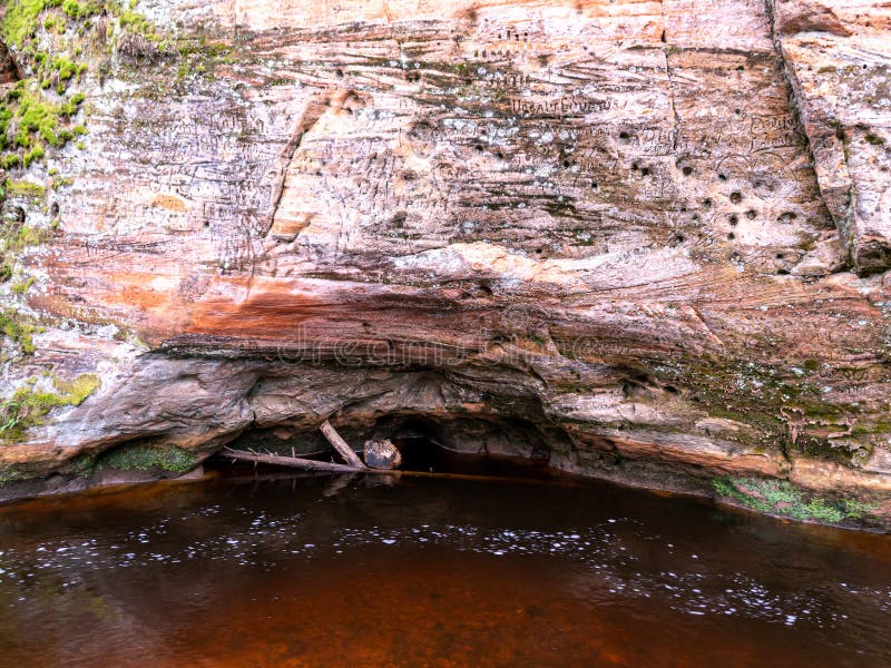 Sandstone Rock Wall by the River with Forest, Rock Reflection in the ...
