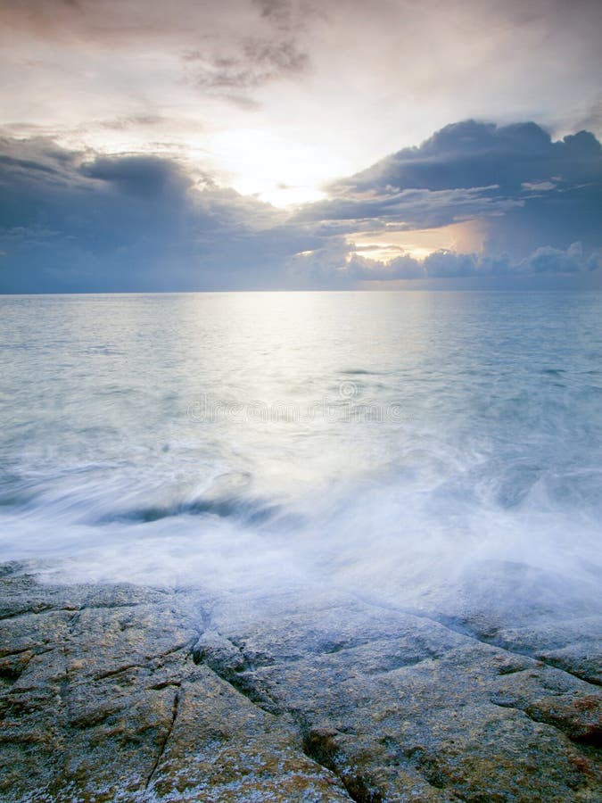 Landscape of sea with rock stock image. Image of sunset - 24579807