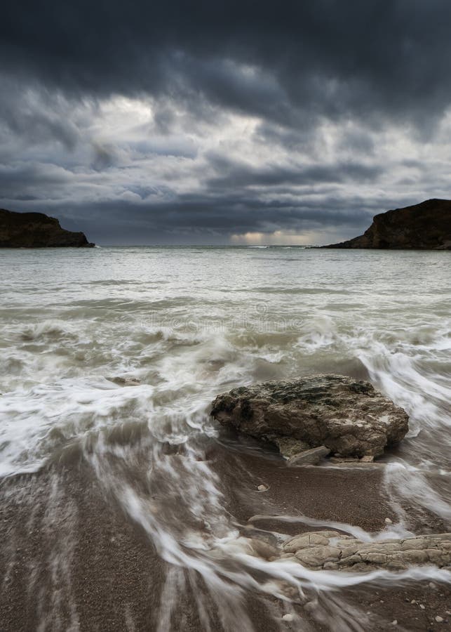 Landscape of Sea Storm Approaching Beach with Rocks in Foreground Stock ...