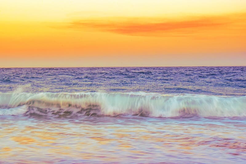 Landscape of Sea Waves during an Orange Sunset in the Evening Stock ...