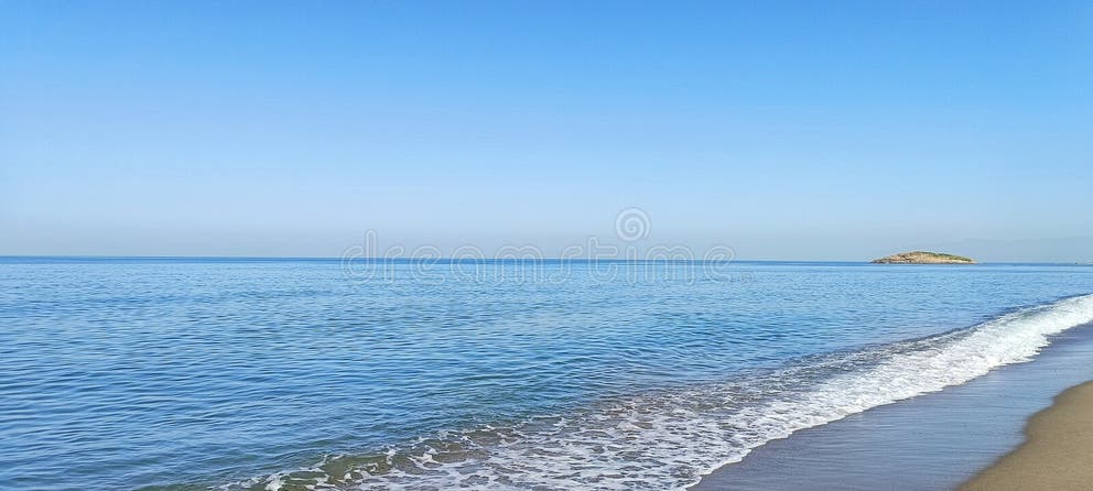 See Side with Waves and a Far Island Stock Image - Image of ocean ...