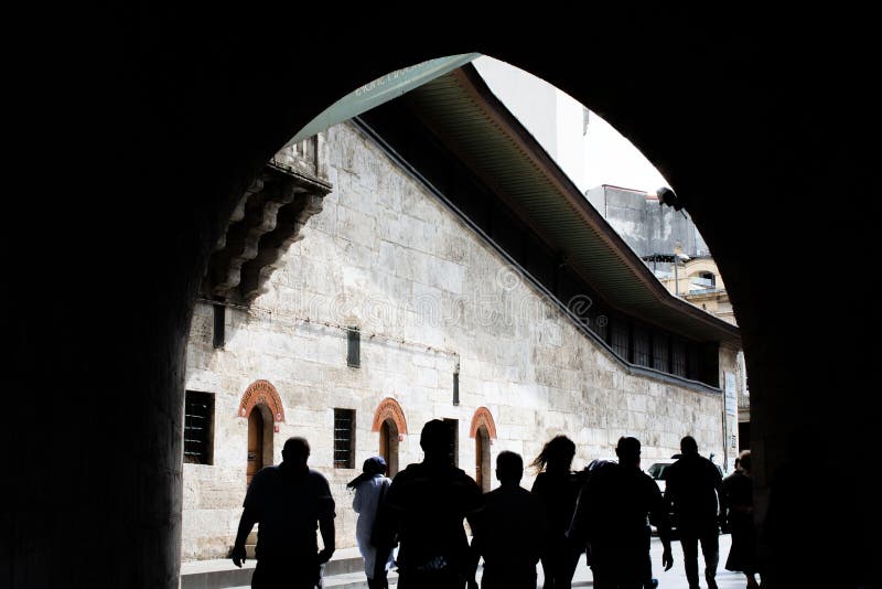 Landscape Shot of People Walking through an Arch Stock Image - Image of ...