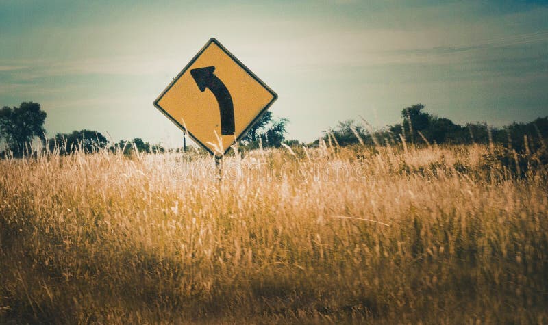 Landscape Shot of a Road Sign Leading Left Stock Photo - Image of blue ...