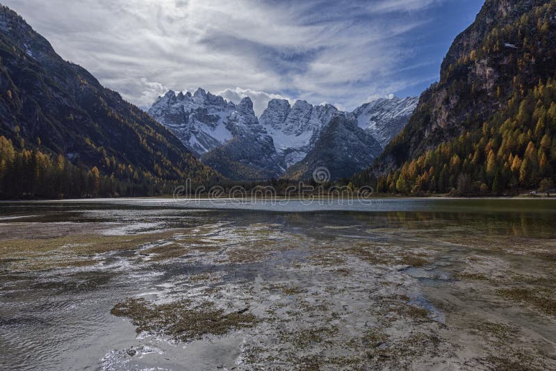Landscape Shot at Snowy Alps with Sharp Peaks and Fluffy Clouds Stock ...