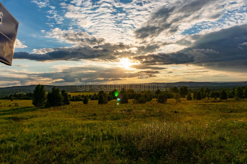Landscape Landscape and a Signpost on the Road with an Arrow Stock ...