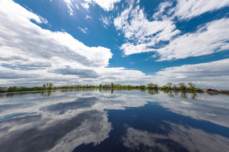 The Flooding River in Spring on the Landscape with Blue Sky Reflection ...