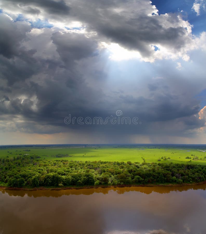 Landscape with Storm Clouds and River Stock Photo - Image of lightning ...