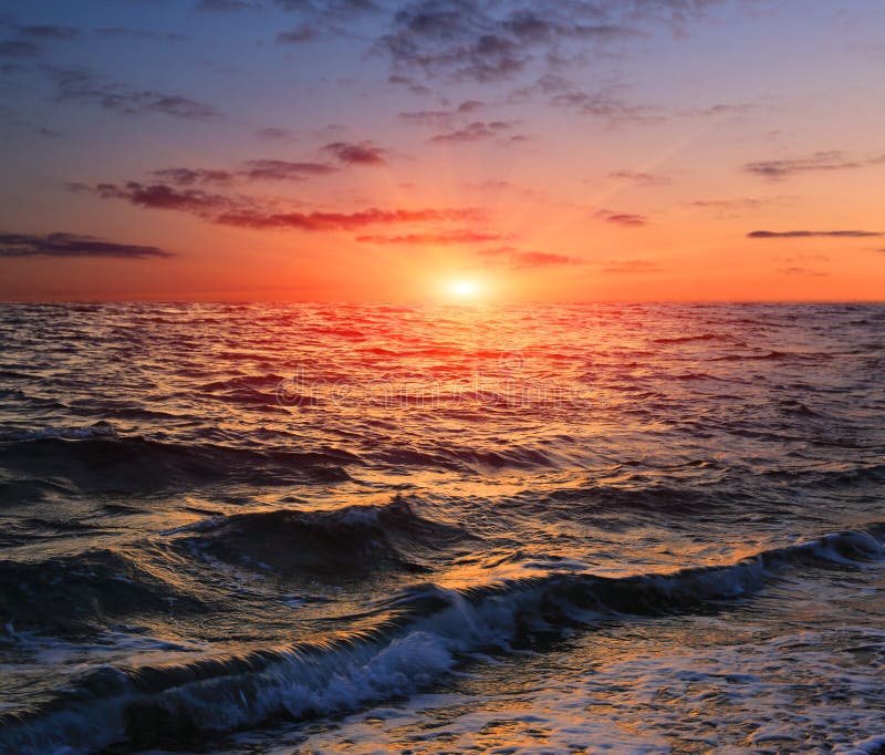 Sunset over ocean beach stock photo. Image of lake, rock - 41842172