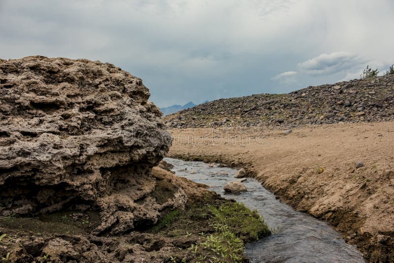 A Landscape with Tiny Rill Flowing through the Rocks Stock Image ...