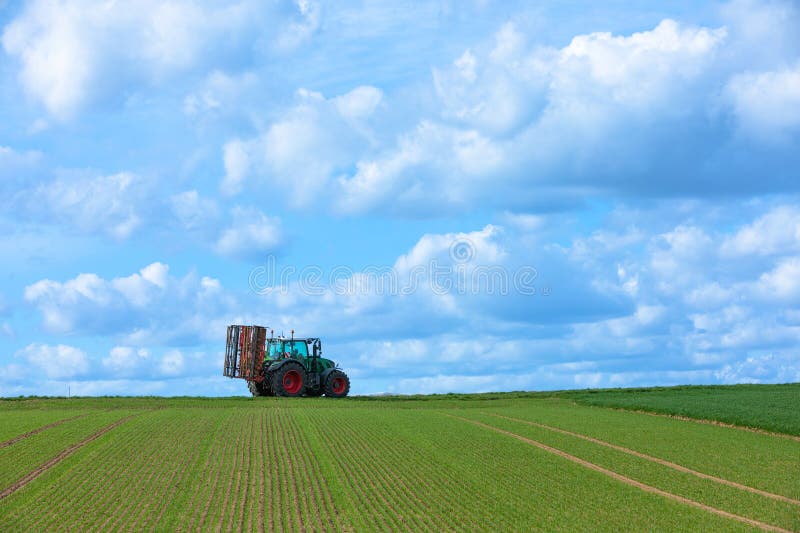 Landscape with tractor stock image. Image of waeather - 275832449