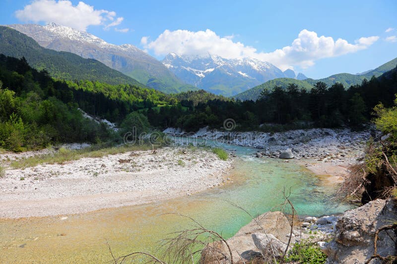 Landscape of the Valley and the Flowing Stream and Mountains in the ...