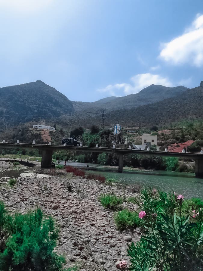 Landscape of a Valley in Front of a Mountain with a Cloudy Sky Stock ...