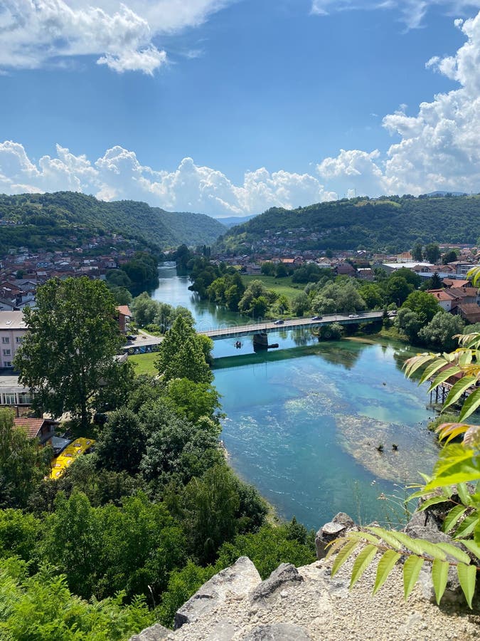 Landscape View of the Bridge Over the Narrow River between the Lush ...