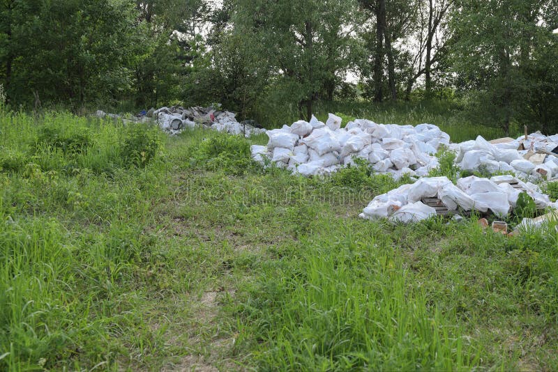 Landscape View on a Green Forest and Grass with Huge Garbage Dump ...
