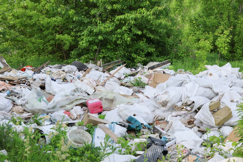 Landscape View on a Green Forest and Grass with Huge Garbage Dump ...