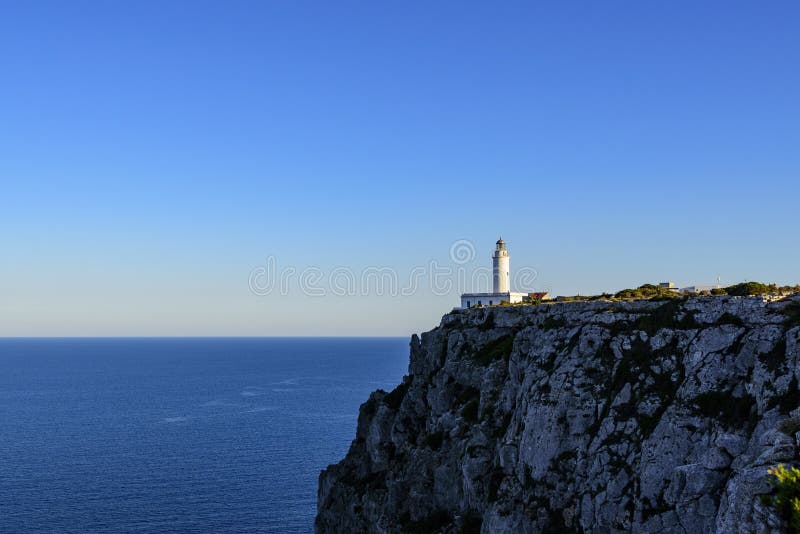 White Maritime Lighthouse with Blue Sky Stock Image - Image of rock ...