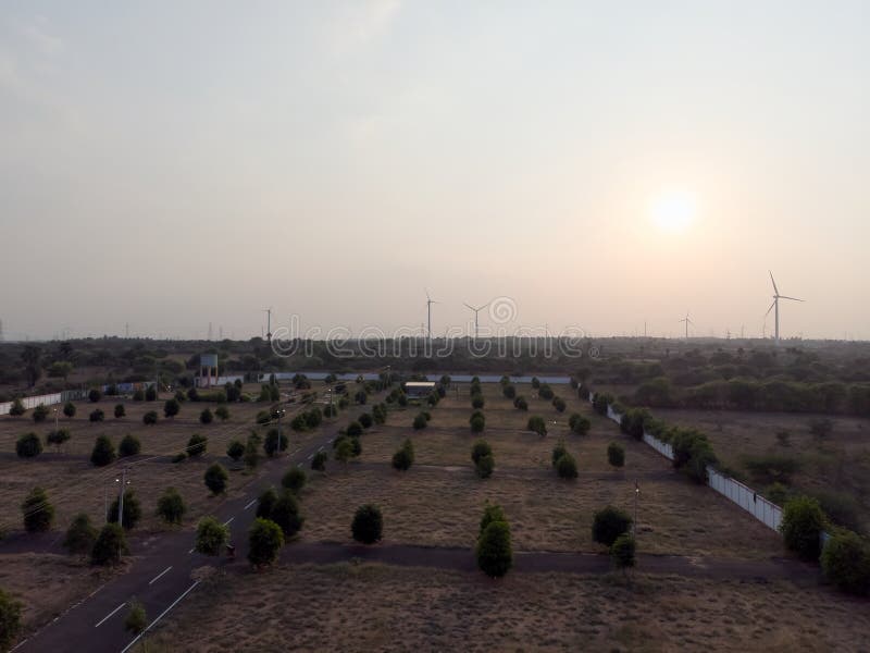 Landscape with Wind Turbines at Sunset in Rural Area Stock Photo ...