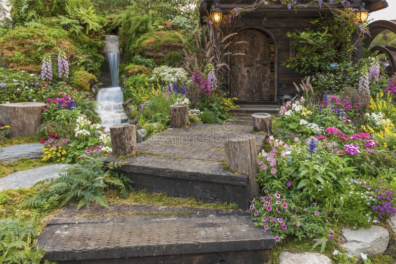 Backyard flower garden stock photo. Image of garden - 129134714