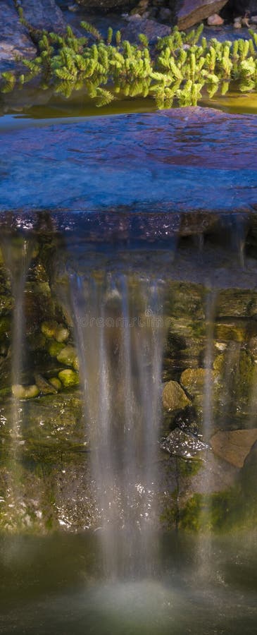 Landscaped yard waterfall stock image. Image of moving - 122357309