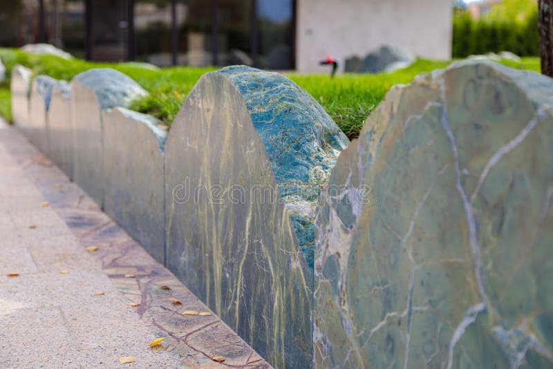 Landscaping, Edging the Path with Boulders of Diabase Stone. Stock ...