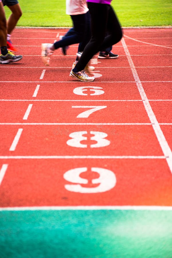Red running track stock image. Image of healthy, grass - 36181395