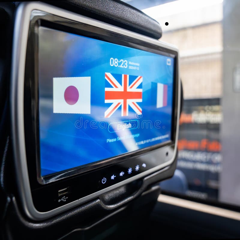A Language Selection Screen is Displayed on a Touch Monitor Mounted Behind a Bus Seat. the ...
