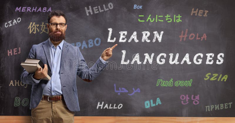 Language Teacher in Front of a Blackboard with Text Learn Languages ...