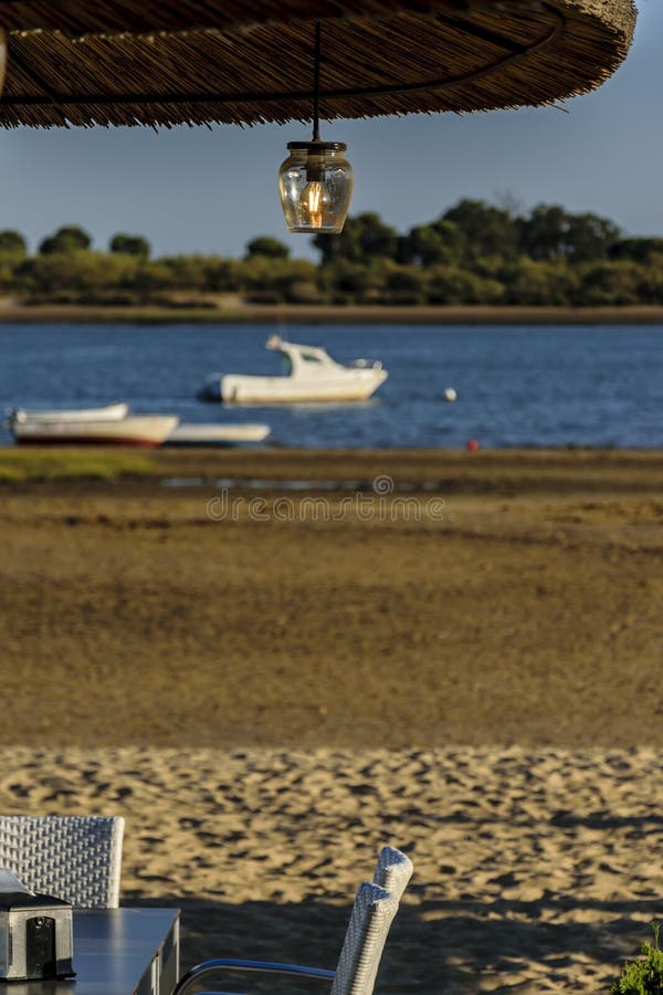 A Lantern Lights a Terrace by the Sea at Sunset Stock Image - Image of ...