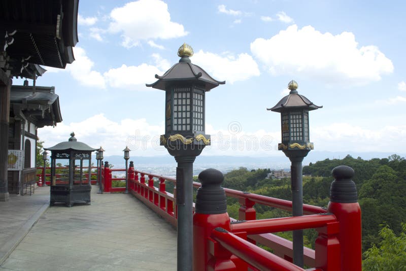 Lanterns and Fence in Front of Temple - Shrine with Tree Foliage in ...