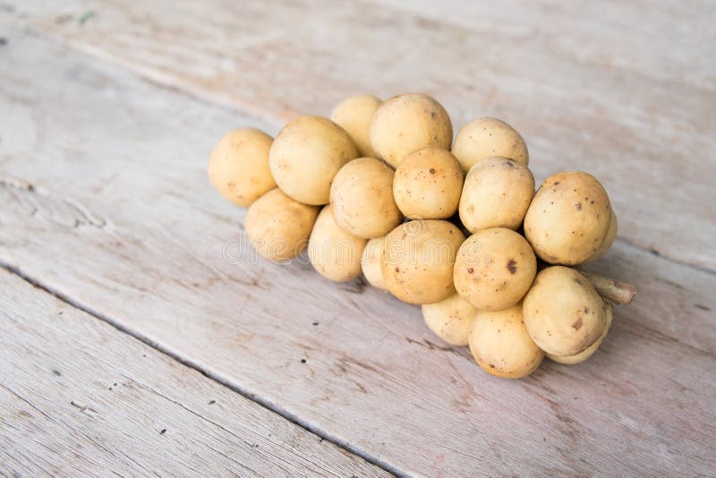 Lanzones Fruit (Longkong) on Wooden Table Stock Photo - Image of ...