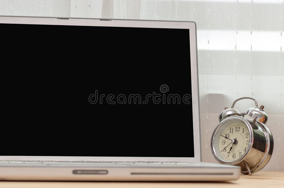 Laptob and old clock stock image. Image of communication - 94449987
