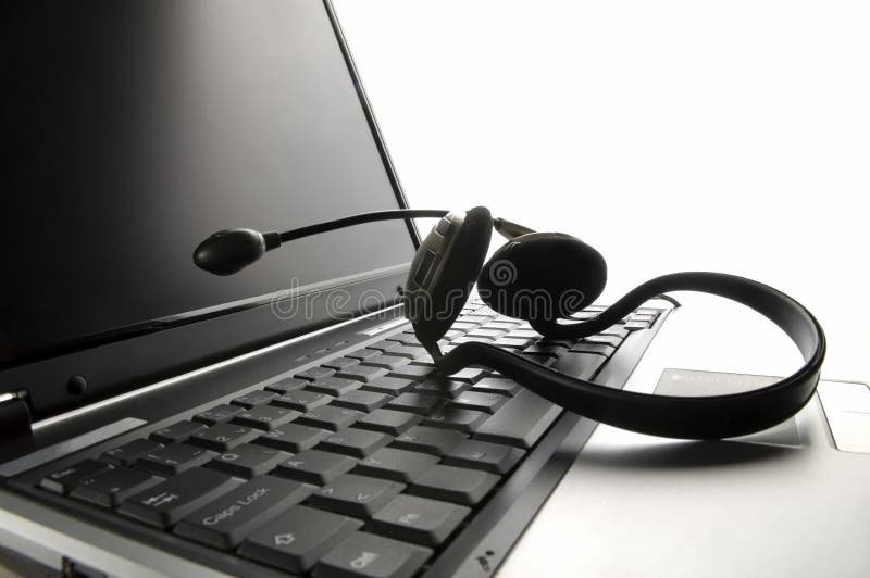 Laptop Computer with Headset on Keyboard Stock Image - Image of contact ...